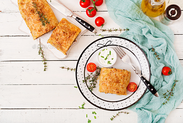 Appetizing strudel with minced beef, onions and herbs. Flat lay. Top ...