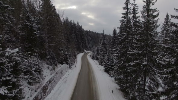 Car Driving on Winter Country Road in Snowy Forest, Aerial View From ...