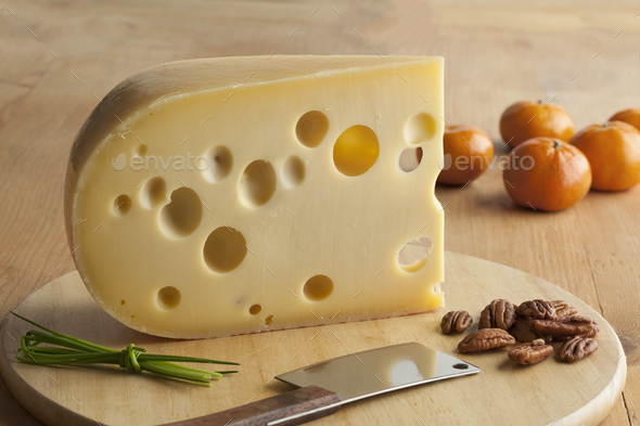 Piece of emmenthaler cheese Stock Photo by picturepartners | PhotoDune