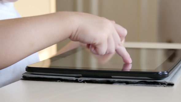 The Child's Fingers Touch the Touch Screen of the Tablet , Stock Footage