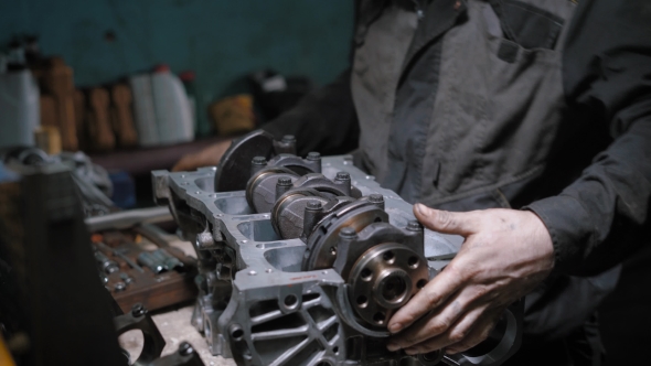 Close Shot at the Hands of a Man Who Collects a Broken Engine, Stock ...