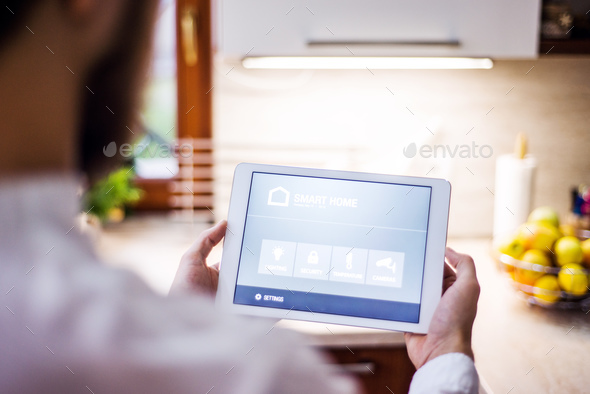 A tablet with smart home screen. Stock Photo by halfpoint | PhotoDune