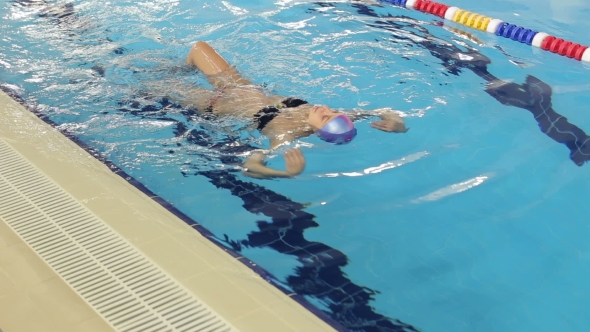 Athletic Pregnant Woman Floating on Back in Pool, Stock Footage | VideoHive
