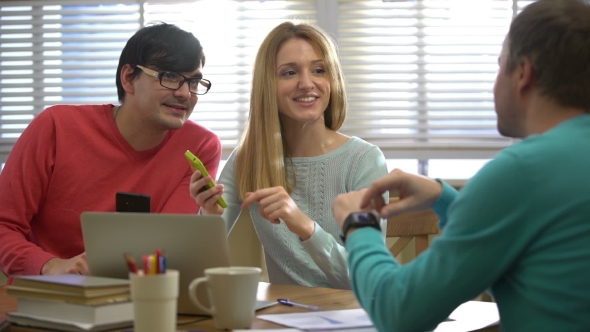 Young People Using Different Electronic Gadgets in the Office, Stock ...
