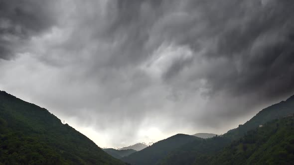 Thick Dark Stratonimbus Clouds Covered The Valley Between Forested ...
