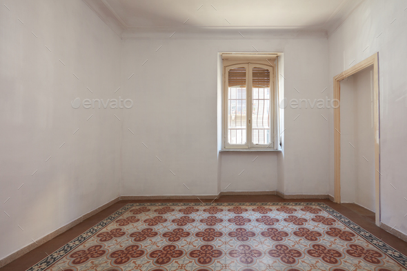 Empty room interior with tiled, decorated floor Stock Photo by andreahast