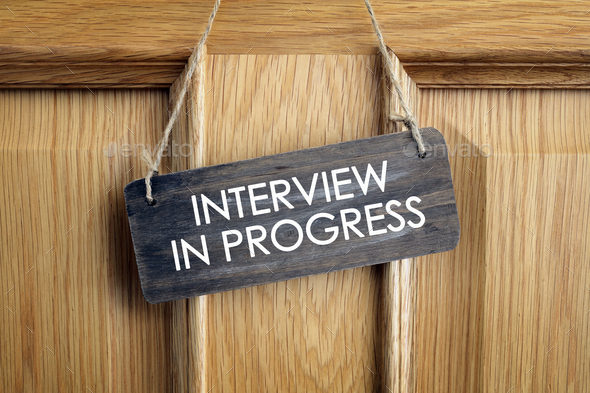 Interview in progress sign on office door Stock Photo by BrianAJackson
