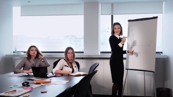 Three Girls Work in the Office and Build Graphics, Stock Footage ...