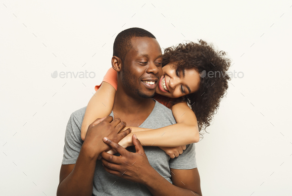Black couple hugging and posing at white background Stock Photo by ...