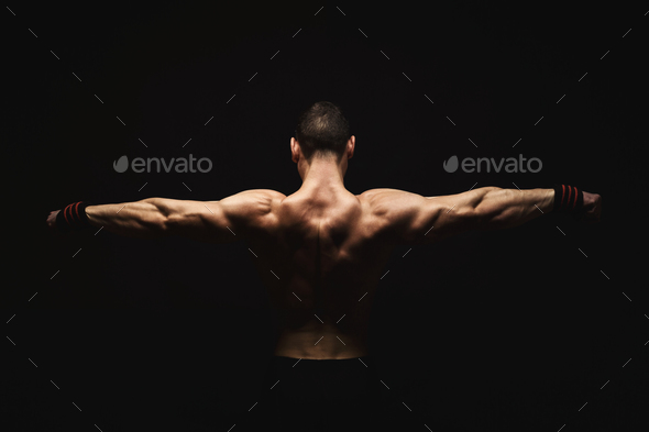 Unrecognizable man shows strong back muscles closeup Stock Photo by ...