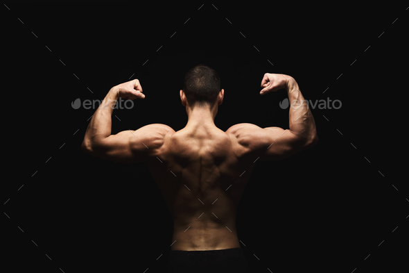 Unrecognizable man shows strong back muscles closeup Stock Photo by ...