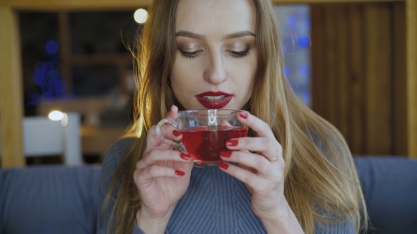 Portrait of Pretty Girl Drinking Hot Tea and Smiling at Camera, Stock ...