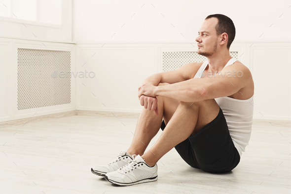 Male bodybuilder having rest after workout Stock Photo by Prostock-studio