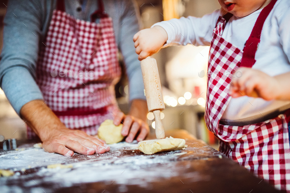 Young family making cookies at home. Stock Photo by halfpoint | PhotoDune