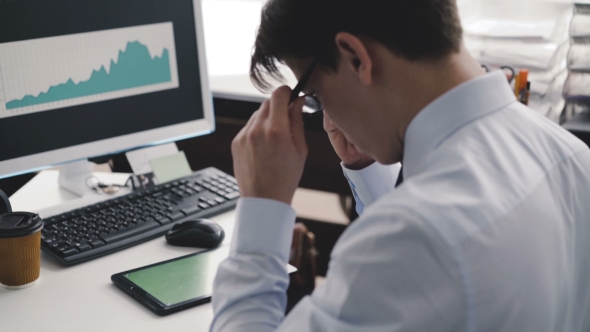 A Man Reading From a Tablet with a Green Screen at Camera, Stock Footage