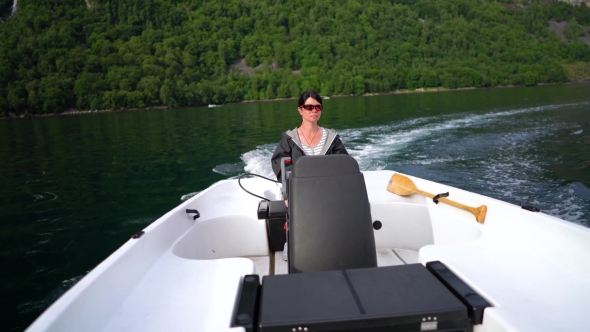 Woman Driving a Motor Boat, Stock Footage | VideoHive