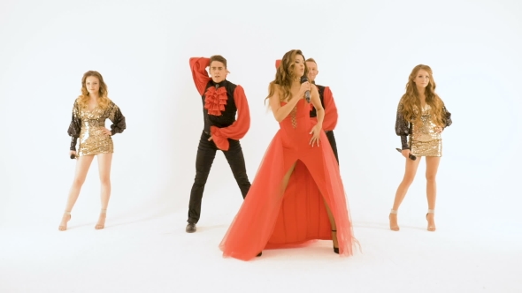 Beautiful Singer in a Red Dress, Singing and Dancing in the Studio on a ...