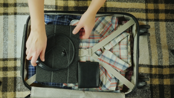 A Woman Unpacks Her Baggage on Arrival at the Hotel, Stock Footage