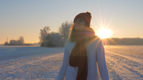 Pretty Woman Frosty Winter Walks Through Snowy Field In Warm Rays Of ...