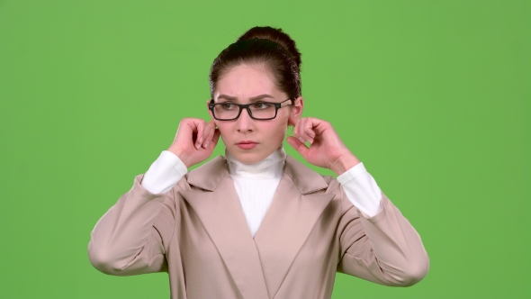 Girl Closes Her Ears From a Sharp Noise. Green Screen, Stock Footage