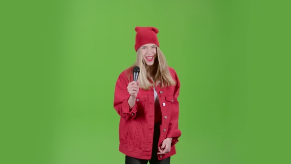 Singer Performs Popular Songs in the Microphone on Stage. Green Screen ...