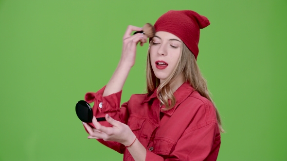 Girl Is Applying Makeup with a Brush and Smile. Green Screen, Stock Footage