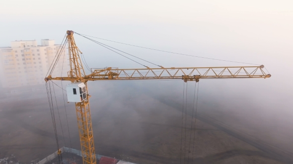 Construction Site in the Fog with a Bird's Eye with Tower Cranes on the ...