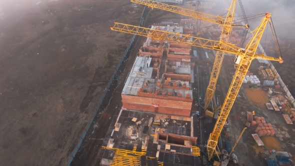 Construction Site in the Fog with a Bird's Eye with Tower Cranes on the ...