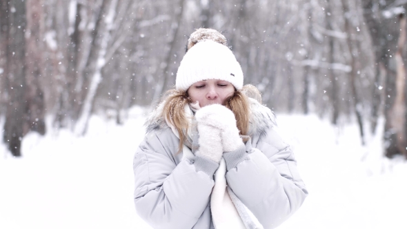 Portrait of a Cute Girl in the Winter During Snowfall., Stock Footage