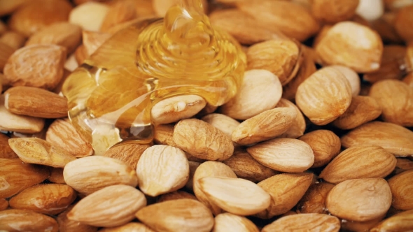 Pouring Honey on Almond, Stock Footage | VideoHive