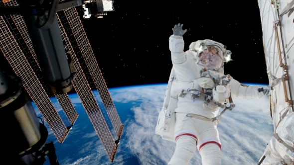 Astronaut Working on Space Station Above the Earth, Motion Graphics