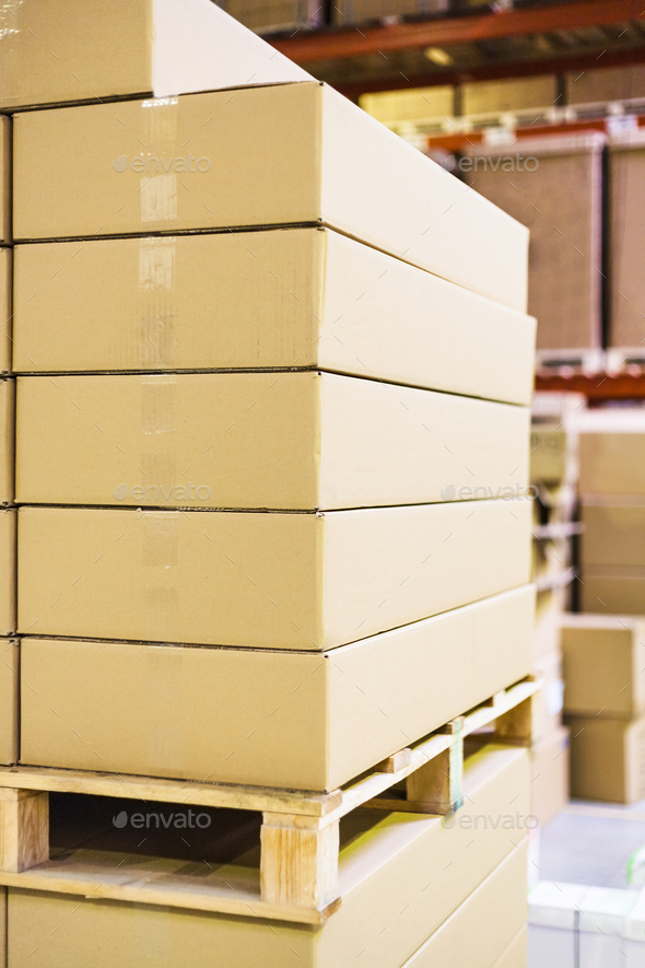 stack of boxes and cartons on wooden pallet Stock Photo by vvoennyy