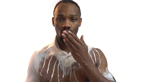 Charming Black Man in White Body Art Sends an Air Kiss, Stock Footage