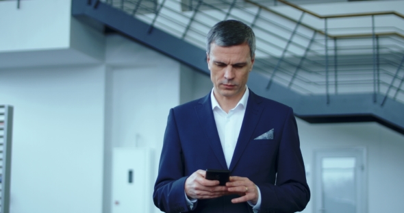 Businessman in Suit Using Phone, Stock Footage | VideoHive