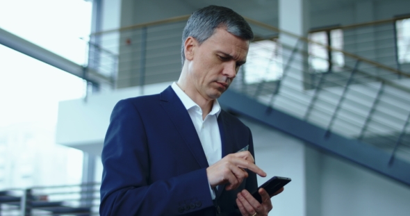 Businessman in Suit Using Phone, Stock Footage | VideoHive