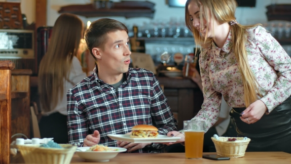 Attractive Man Getting His Burger Order in Cafe, Stock Footage | VideoHive