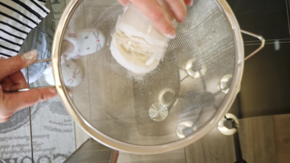 Top View of Sifting Flour Through Sieve., Stock Footage | VideoHive