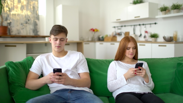 Man and Woman Ignoring Each Other in Their Mobile Phones in Their Home ...