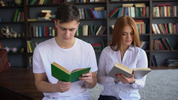 Students Reading a Book in Library, Students Reading Book at School ...