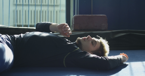 Athlete Rest on the Floor in the Hall, Stock Footage | VideoHive