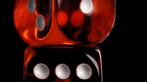 Rotating Red Dice Around Its Axis, on a Black Background, Stock Footage