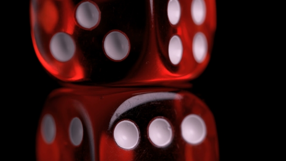 Rotating Red Dice Around Its Axis, on a Black Background, Stock Footage