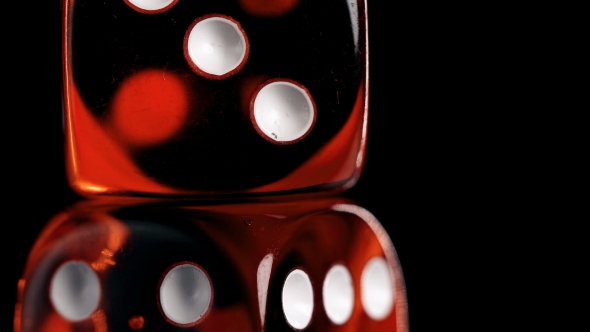 Rotating Red Dice Around Its Axis, on a Black Background, Stock Footage