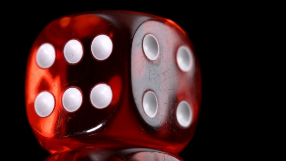 Rotating Red Dice Around Its Axis, on a Black Background, Stock Footage