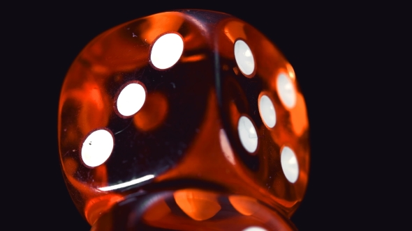 Rotating Red Dice Around Its Axis, on a Black Background, Stock Footage