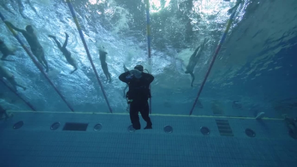 Scuba Diver Swimming in Deep Pool Underwater View. Diving Course in ...