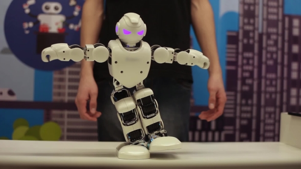 Modern Robotic Technologies. The Robot Moves Its Arms and Legs ...