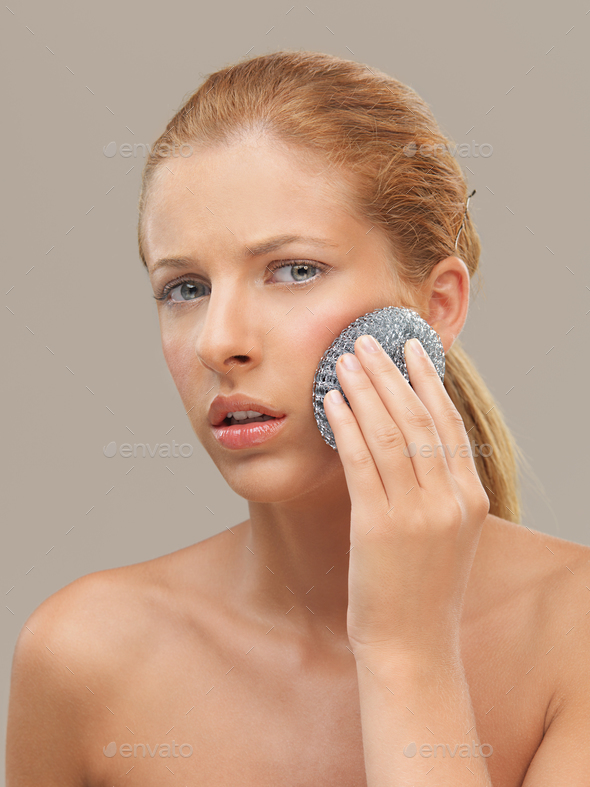 portrait woman using metal dish scrubber face Stock Photo by shotsstudio