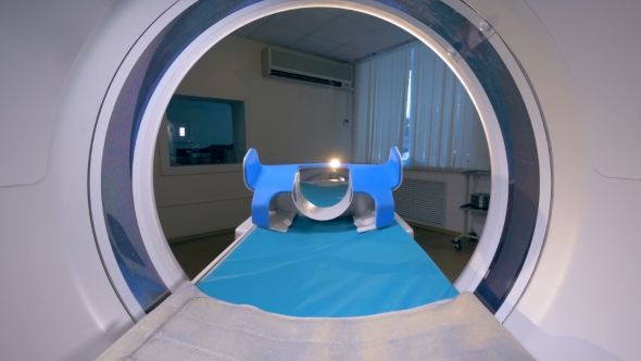 An Empty Patients Cot Moves Inside a CT Scanner, Stock Footage | VideoHive