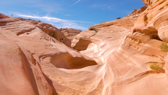 Shot Camera Movement On Dry Gorge With Smooth And Wavy Rocks Of Red ...